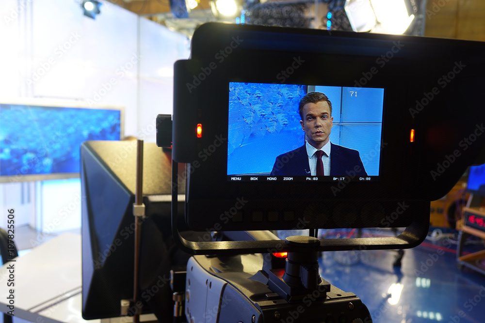 The news presenter reads the text on the teleprompter.Camera in the ...