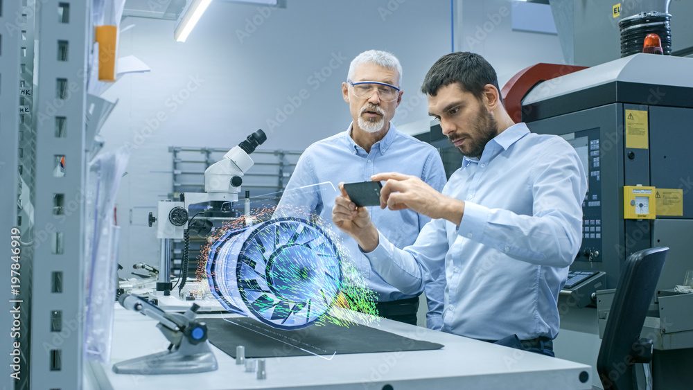Two Engineers Works with Mobile Phone Using Augmented Reality ...