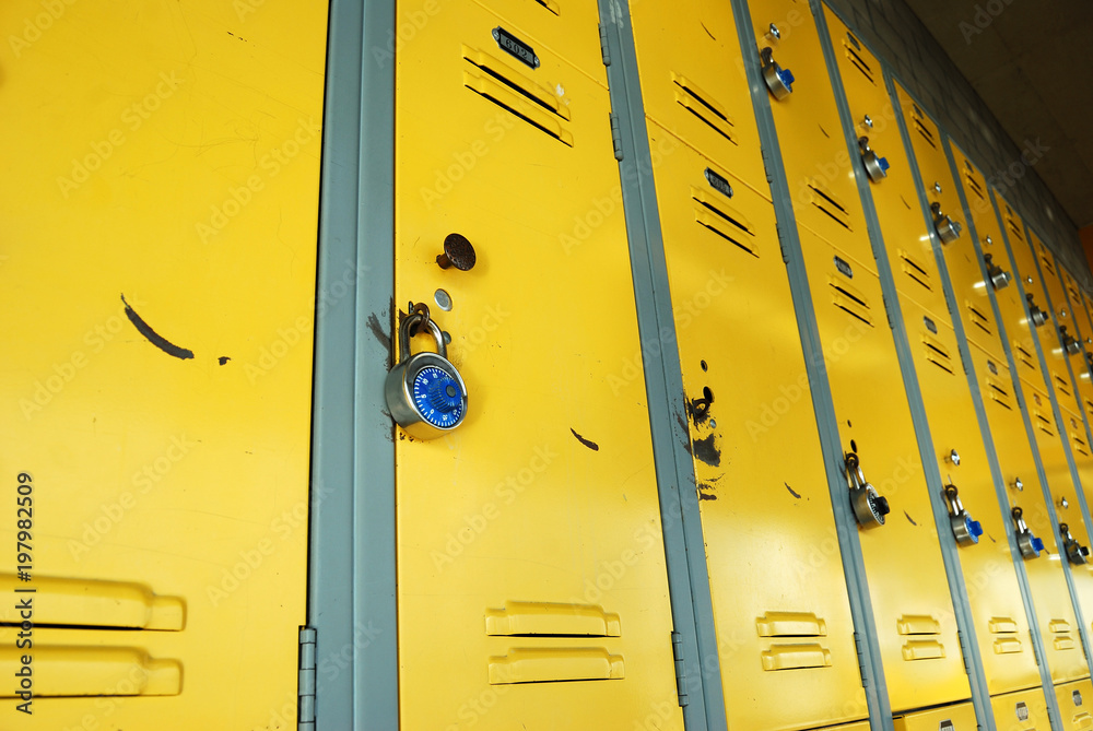 Yellow school lockers with blue combination locks - A low angle view of ...