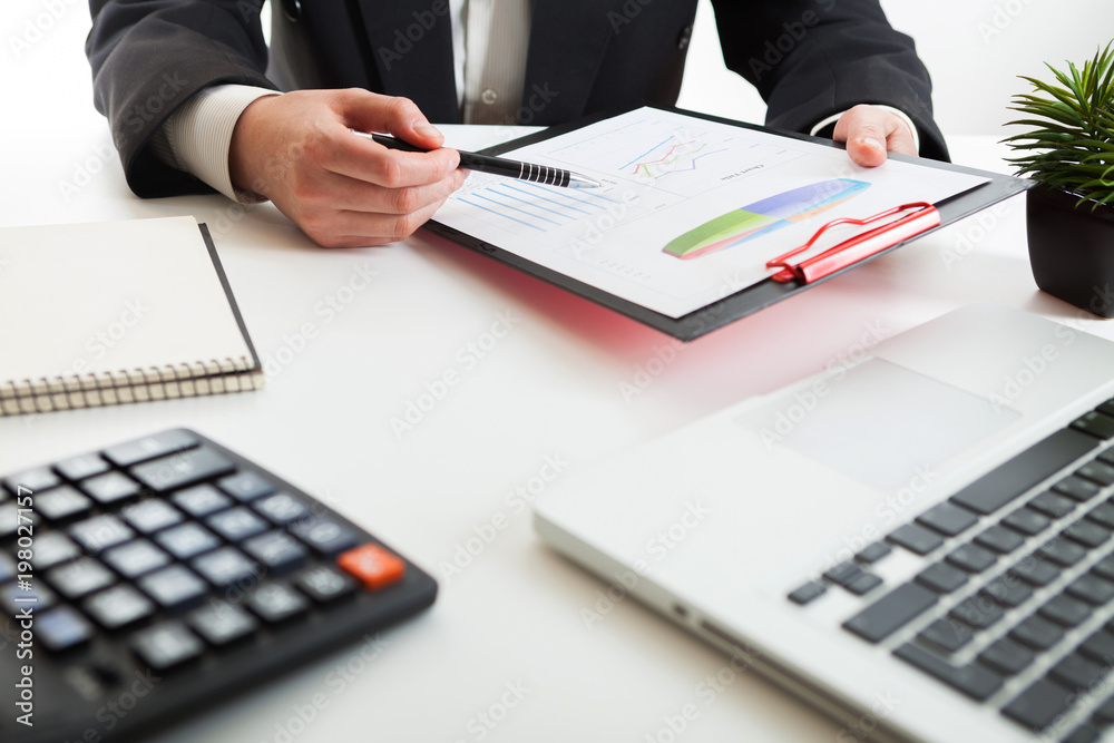 Close up view of bookkeeper or financial inspector hands making report ...