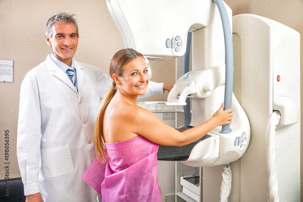 Young woman undergoing mammography with doctor supervision Stock Photo ...
