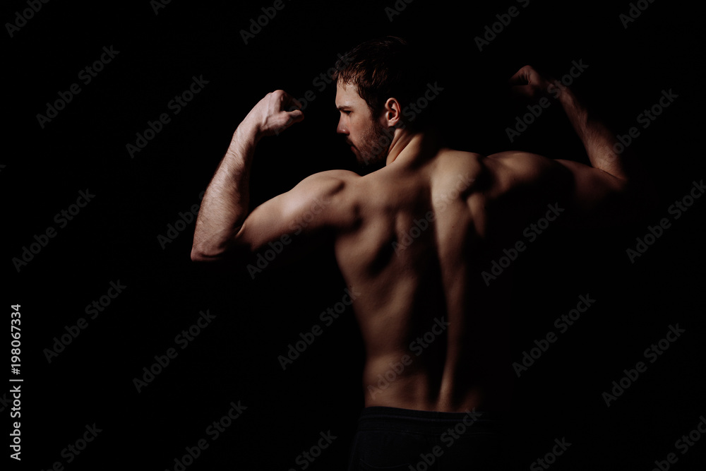 back view photo of strong constitution of young athlete without T-shirt ...
