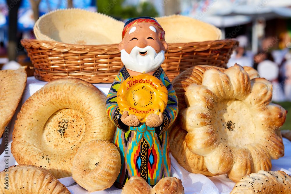 Traditional Uzbek bread called non or lepeshka - flat bread. Oriental ...