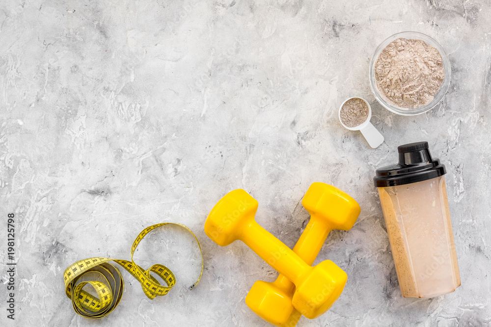 nutrition for workout with protein cocktail, powder and bars on stone ...