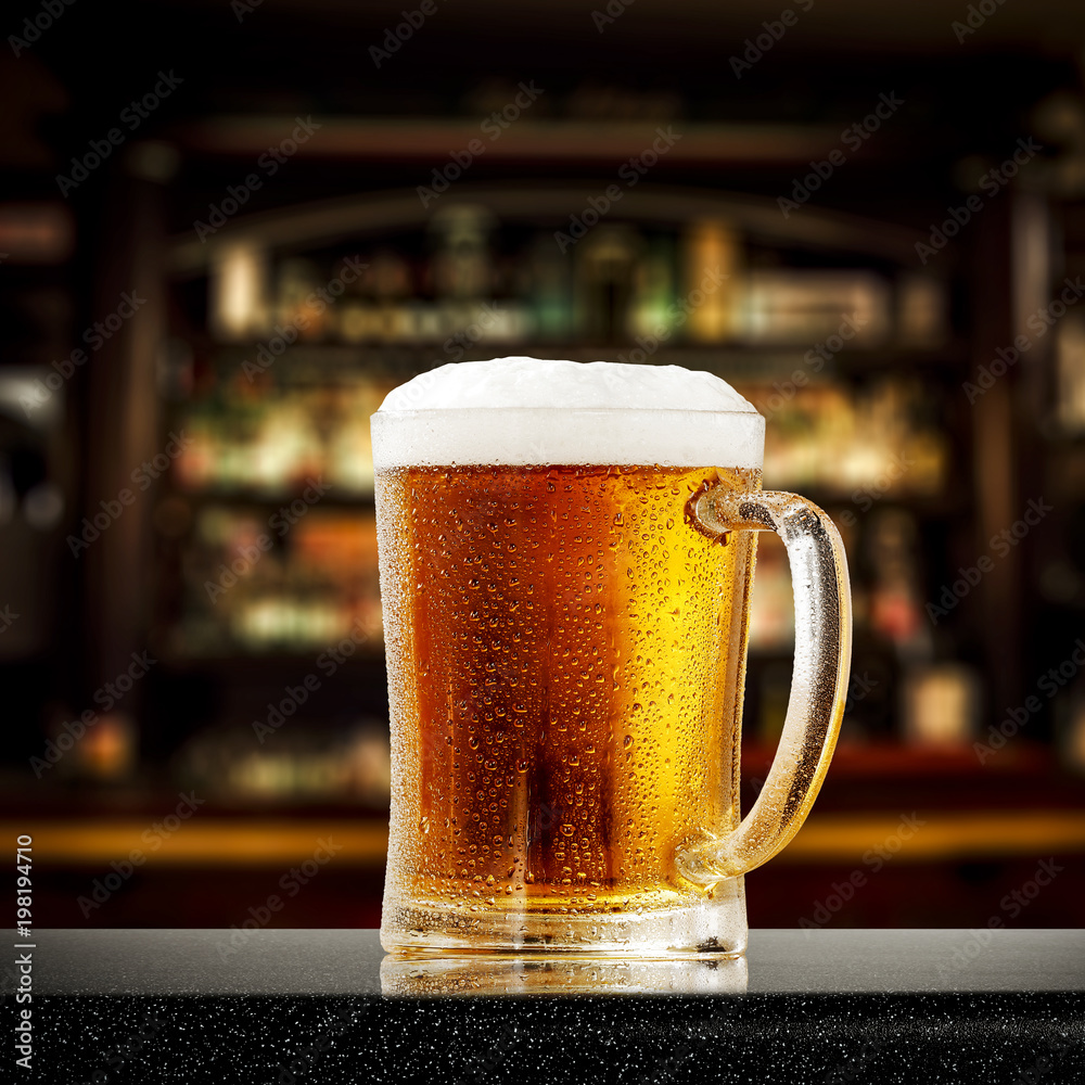 beer and desk with bar background. Stock Photo | Adobe Stock