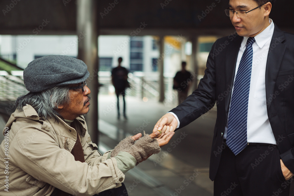 Man Giving Money To Homeless