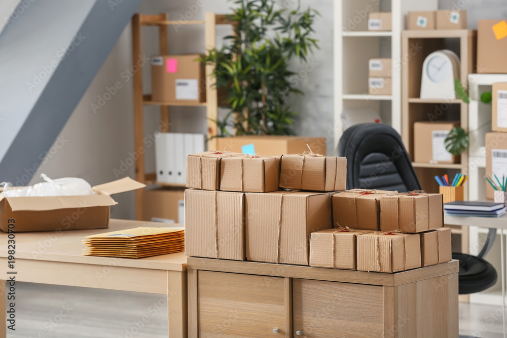 Parcels ready for shipment to client on table in home office Stock ...