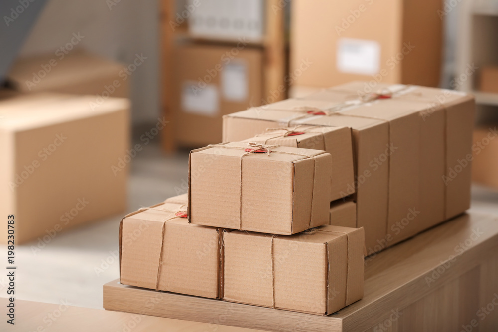 Parcels ready for shipment to client on table in home office Stock ...