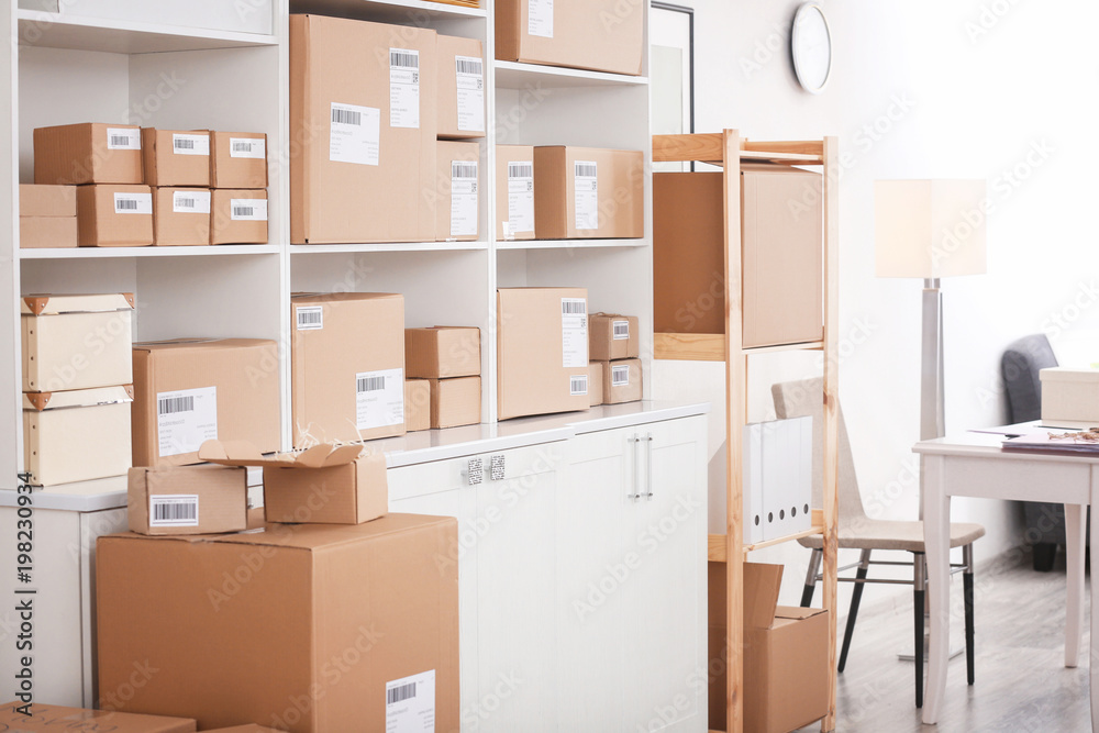 Parcels ready for shipment to client in home office Stock Photo | Adobe ...