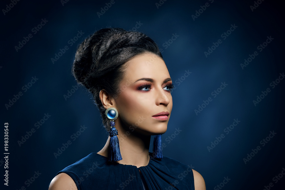 Young, beautiful and rich woman in jewels of platinum and stones over ...