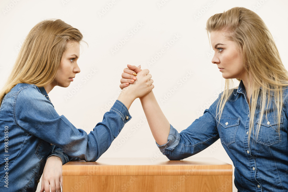 Two women having arm wrestling fight Stock Photo | Adobe Stock