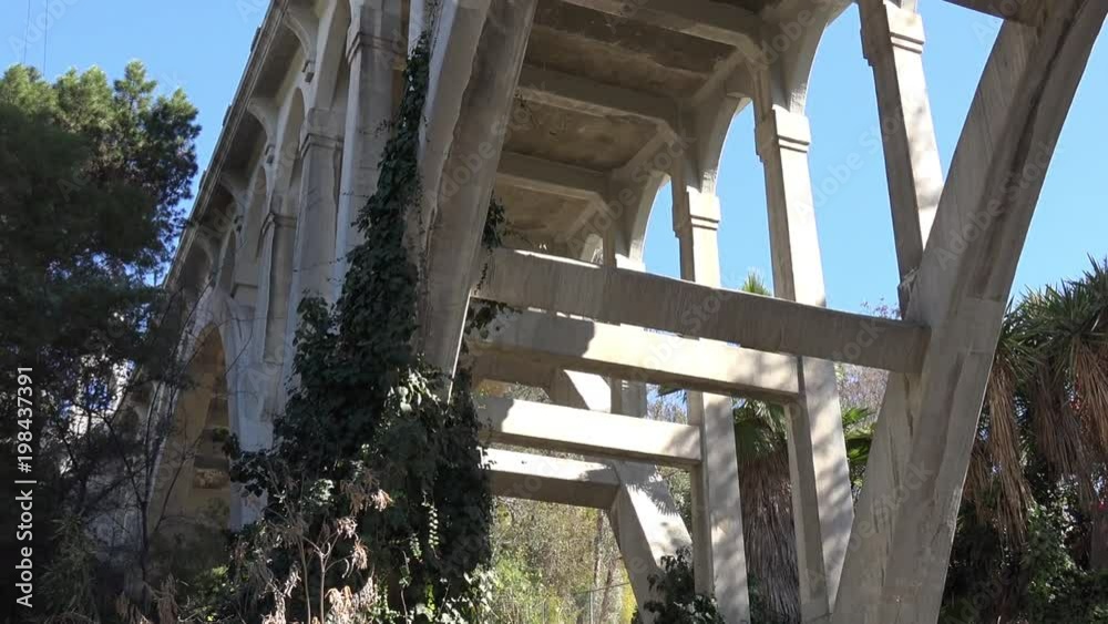 Video „Tilt shot of the underside of a concrete arch bridge, the ...