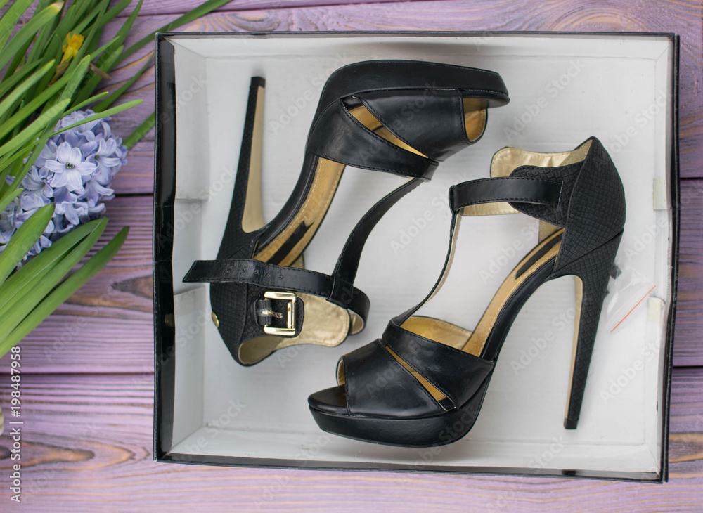 black sandals in a high heel in a box Stock Photo | Adobe Stock