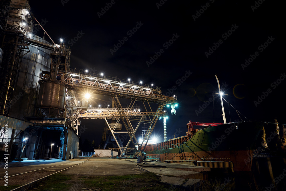 Big grain terminal at seaport. Cereals bulk transshipment from road ...