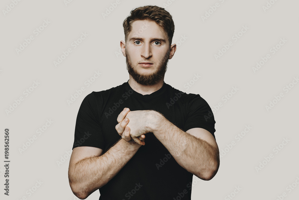 Sporty man doing exercises for stretching the lateral muscles of the ...