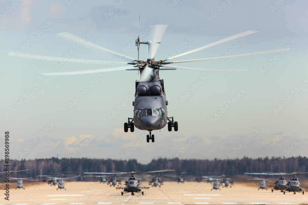 View from the end of a runway on rise of group of helicopters Stock ...