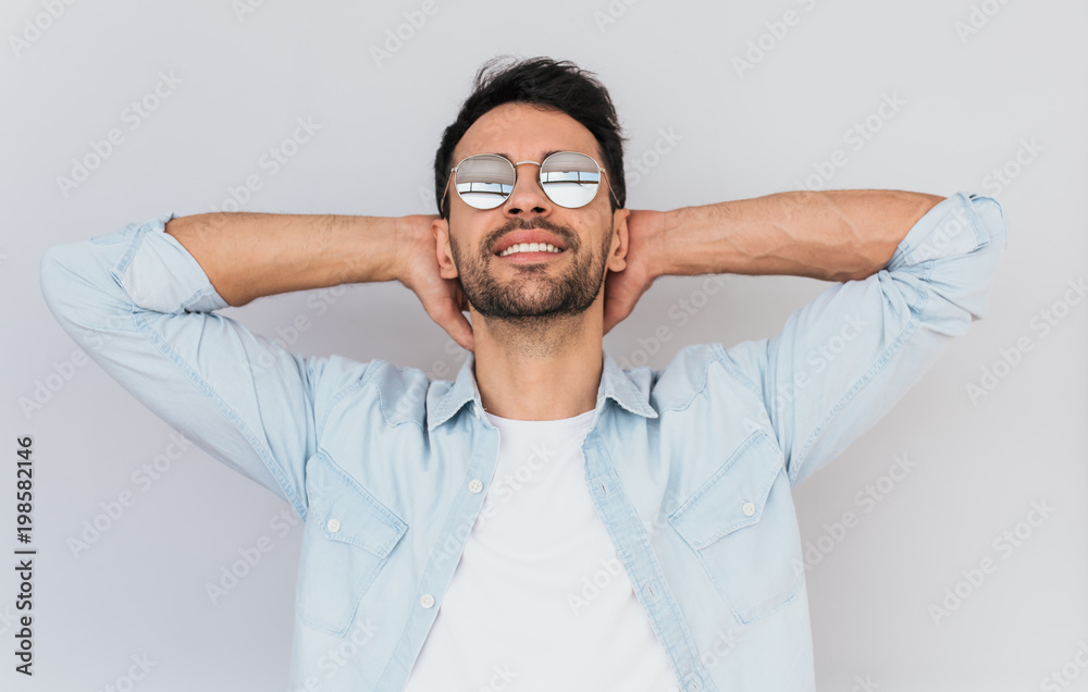 Horizontal portrait of unshaved handsome male model wearing trendy ...