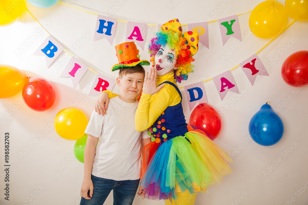 clown girl on the birthday of a child. A party for a child. Adult baby ...