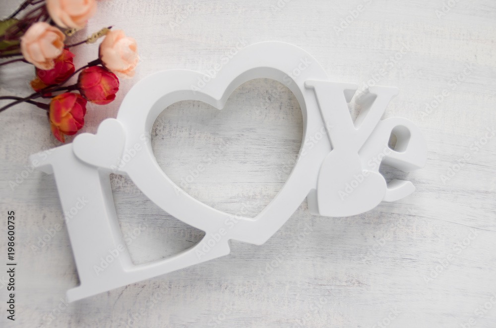 Beautiful, gentle word love on a white wooden background. background ...