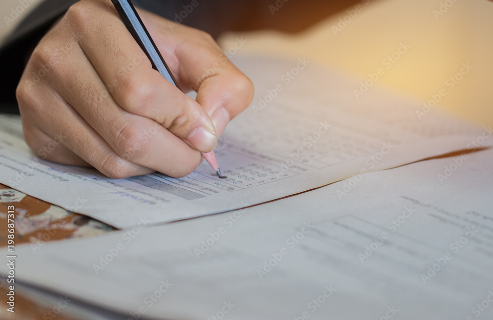 Front view Asian Students, undergraduate holding pencil writing on ...