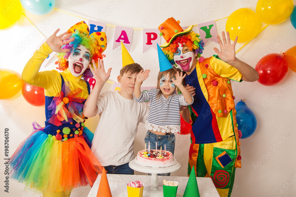 clown girl and clown boy at the birthday of a little girl and her big ...