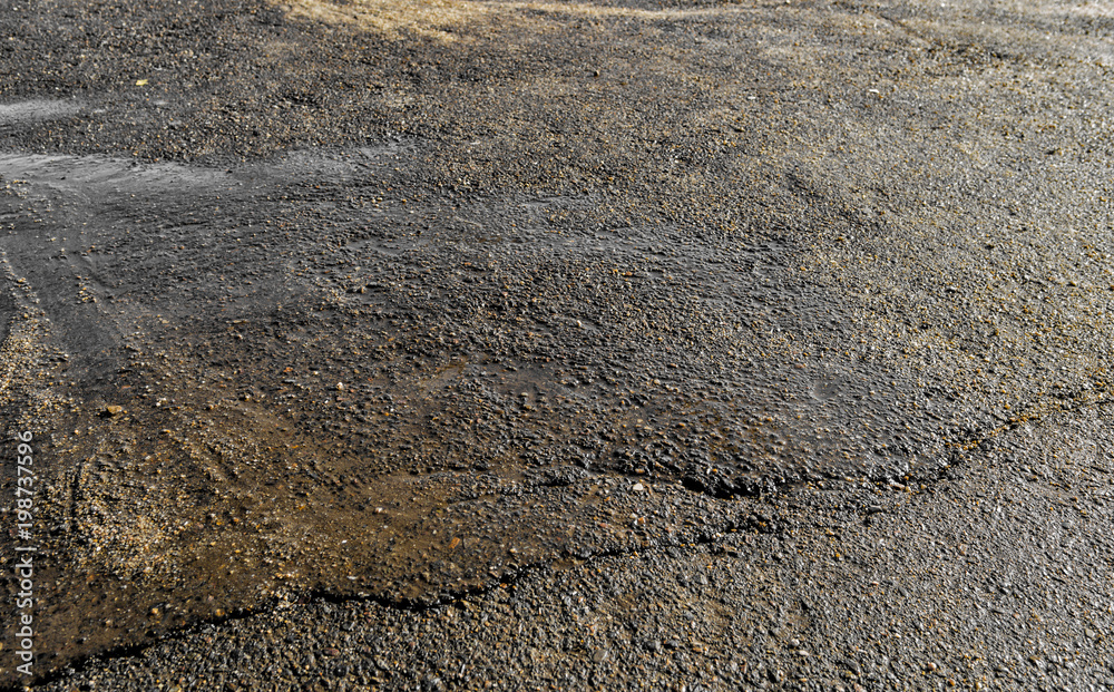 Asphalt background. Asphalt perspective. Wet asphalt road after the ...