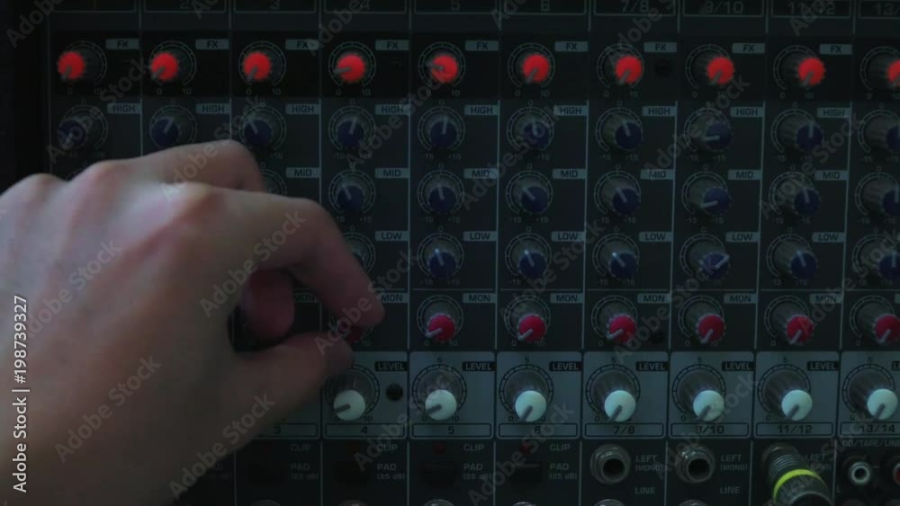 Hand configured many knobs on analog mixer Stock Video | Adobe Stock