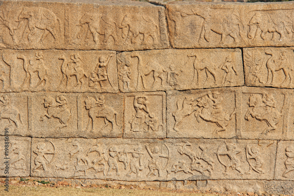 Stone bas-reliefs on the walls in Temples Hampi. Carving stone ancient ...