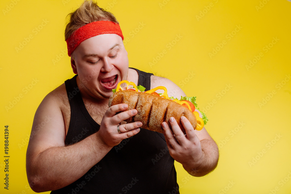 Foto Stock Diet Failure Of Fat Man Eating Fast Food Hamberger Adobe Stock foto-stock-diet-failure-of-fat-man-eating-fast-food-hamberger-adobe-stock