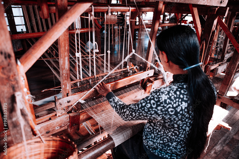 The local Intha woman weaving the lotus cloth with the hand loom at the ...
