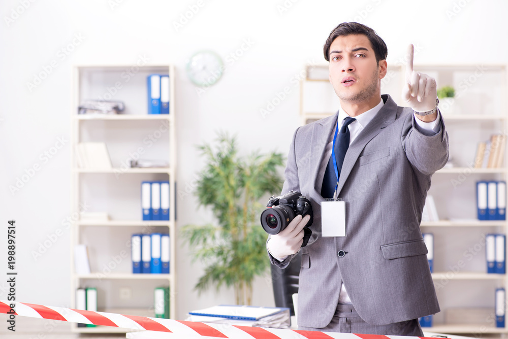 Forensics investigator at the scene of office crime Stock Photo | Adobe ...