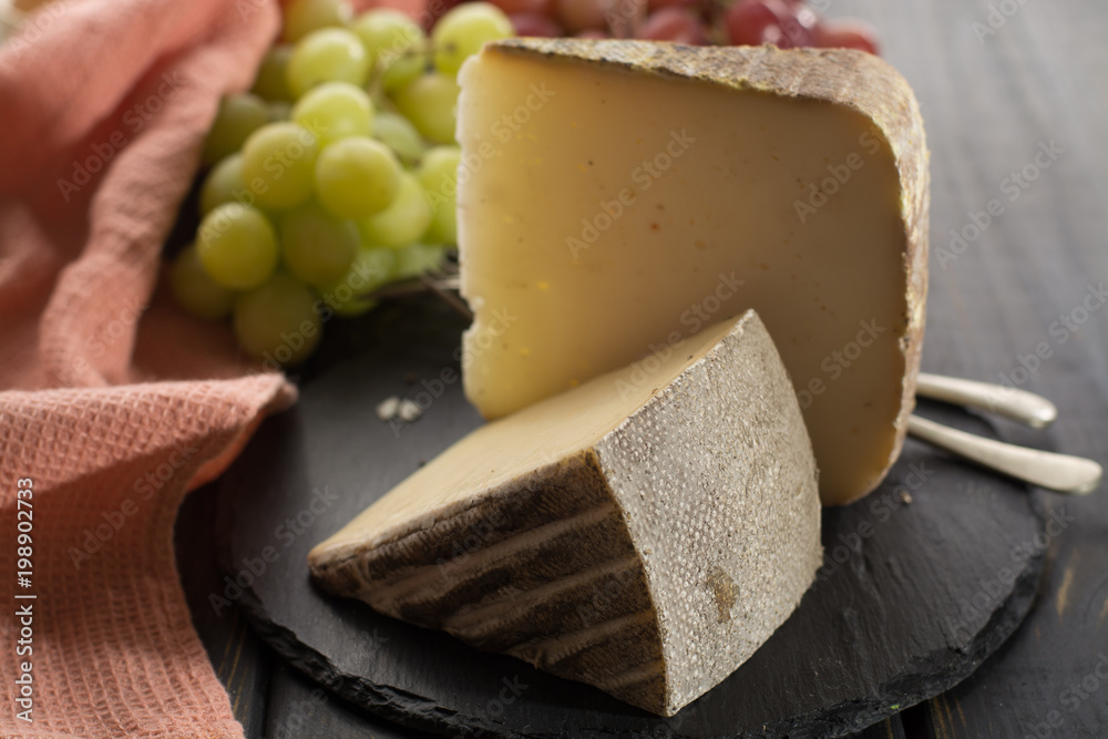 Tasting of ancient french demi soft cheese Tomme from French Alps, made ...