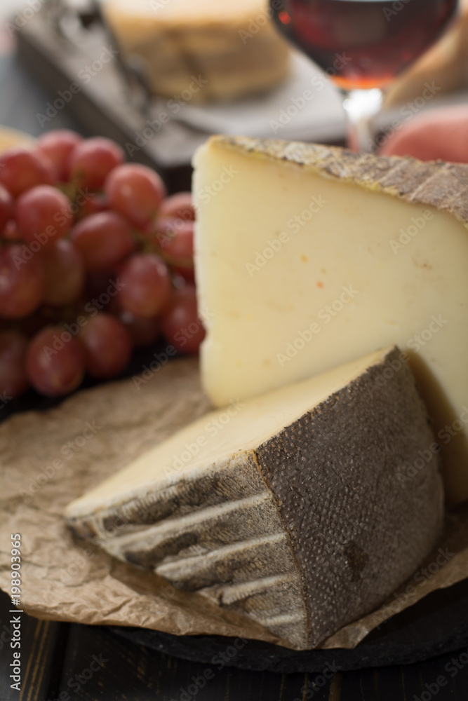 Tasting of ancient french demi soft cheese Tomme from French Alps, made ...