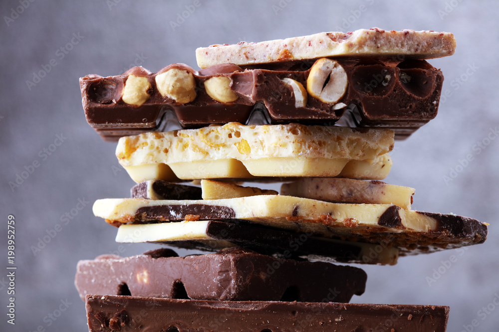 Chocolate bars on table with chocolate tower. Stock Photo | Adobe Stock