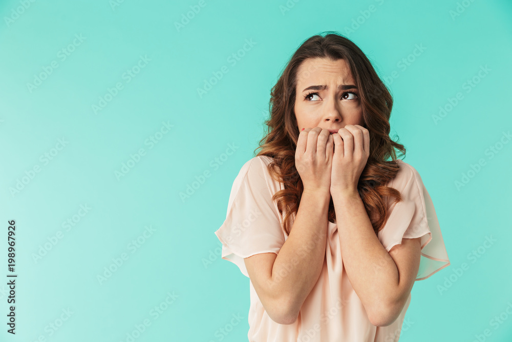Portrait of a frightened young girl in dress looking away Stock Photo ...