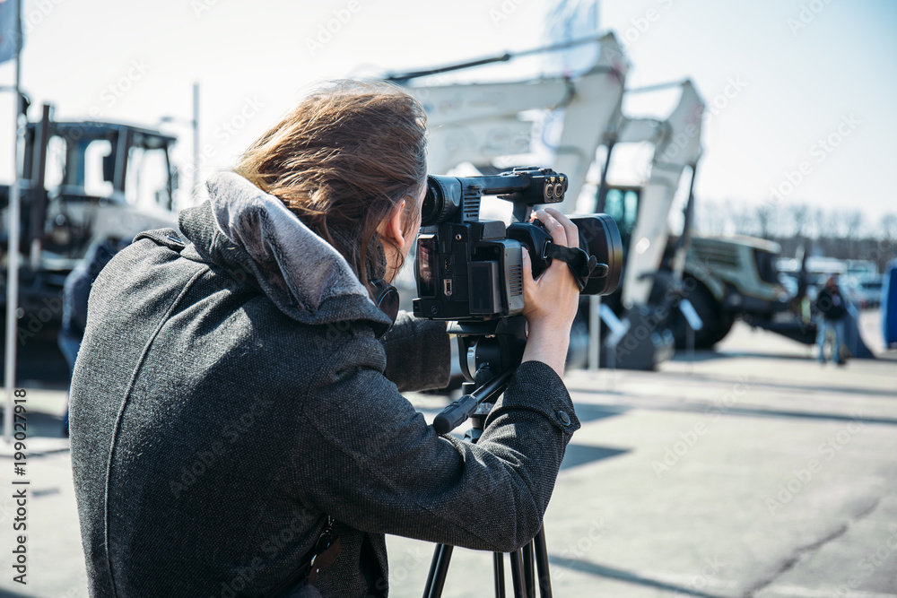 Cameraman or reporter works on street, view from back Stock Photo ...