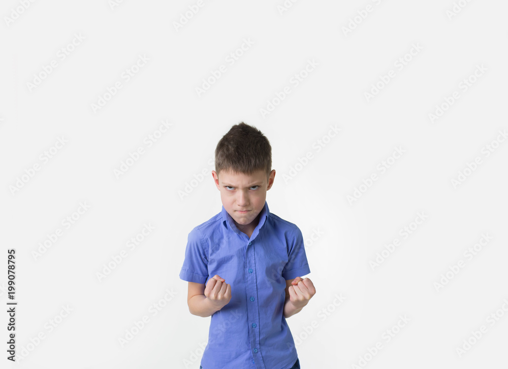 angry young boy with fists clenched isolated on white Stock Photo ...