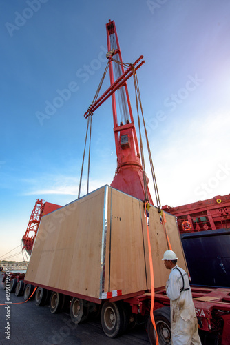 heavy lift cargo handle by professional teamwork to locate package from ...