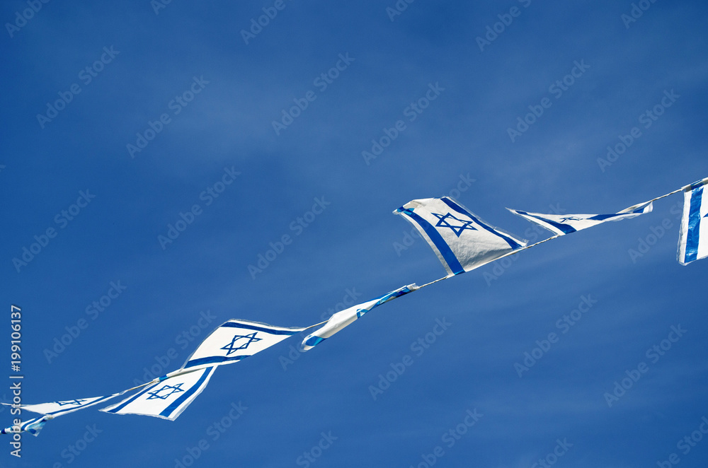 Israel flags, blue and white hanging as a chain, street decoration for ...