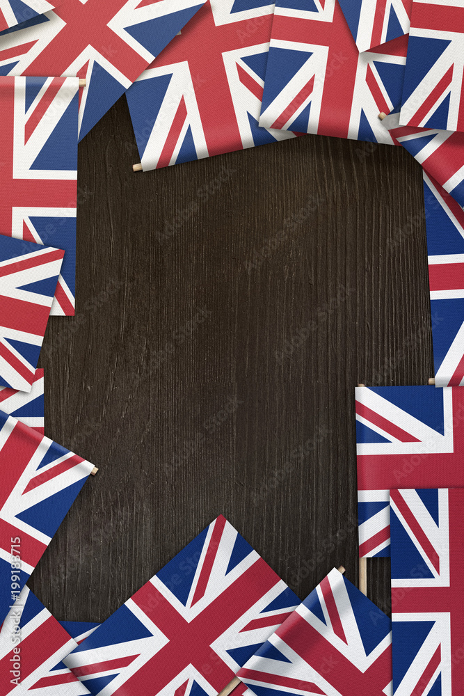 small British flags framing a wood texture background with copy space ...