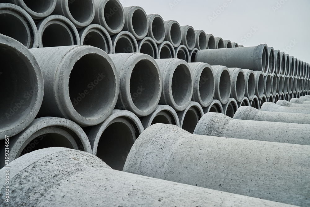 Stacked pipe at concrete factory. Large Concrete Construction Pipes for ...