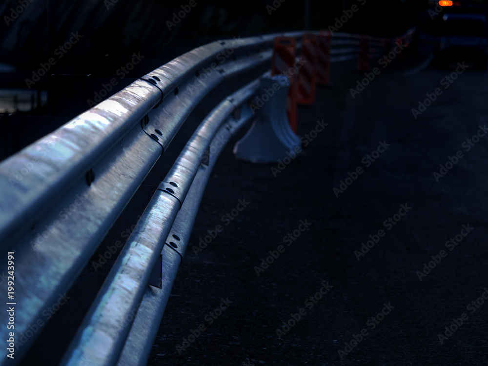 Road at night, headlights. Evening night time. Barrier, guard rail ...
