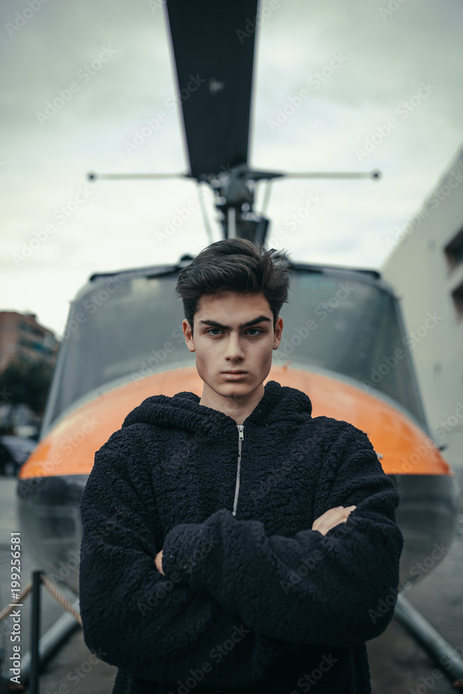 Man at helicopter looking at the camera Stock Photo | Adobe Stock