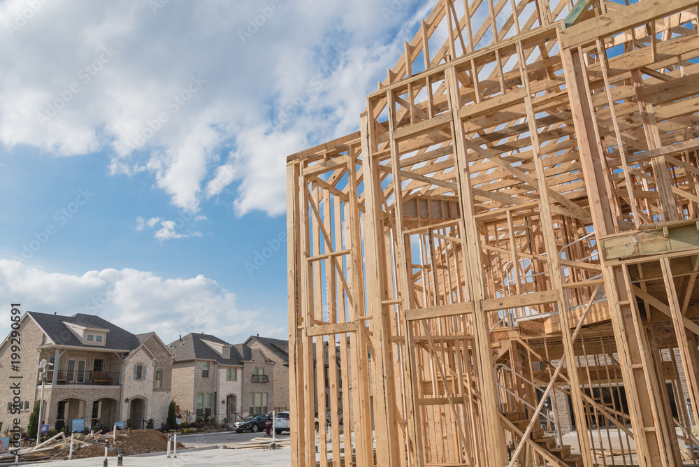 Close-up single-family timber frame house with slab-on-grade concrete ...