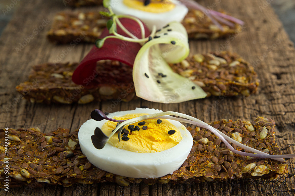 Row of raw bread with sunflower seeds, carrots, sesame, flax seed and ...