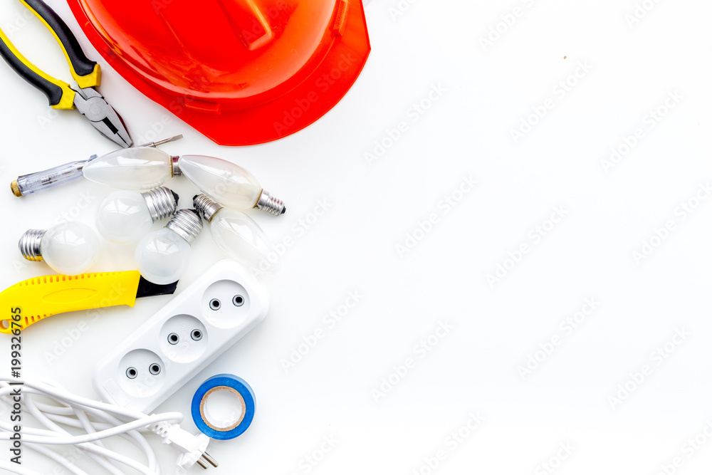 Electrician work concept. Hard hat, tools, cabel, socket outlet on ...