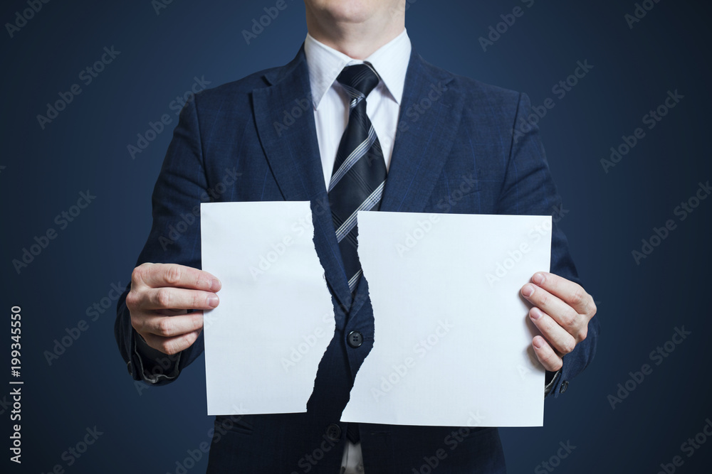 Businessman tearing blank paper apart Stock Photo | Adobe Stock