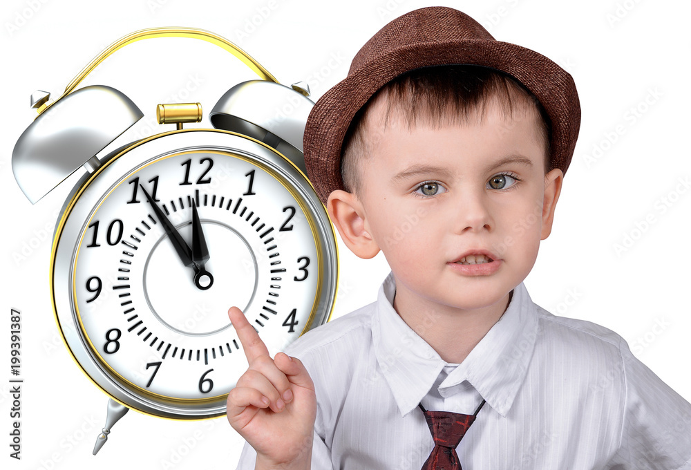 A little boy in a hat is pointing at his watch. The concept of time ...