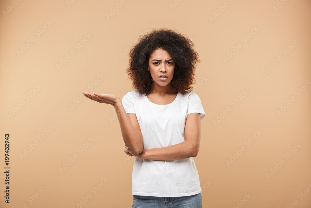 Portrait of a confused young african woman Stock Photo | Adobe Stock