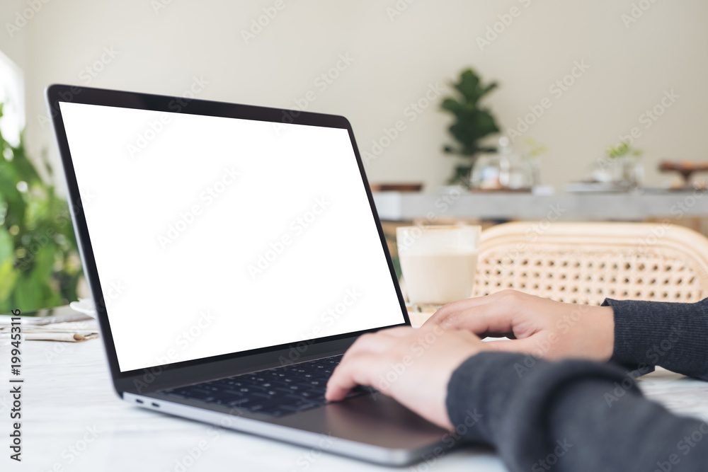 Mockup image of hands using and typing on laptop with blank white ...
